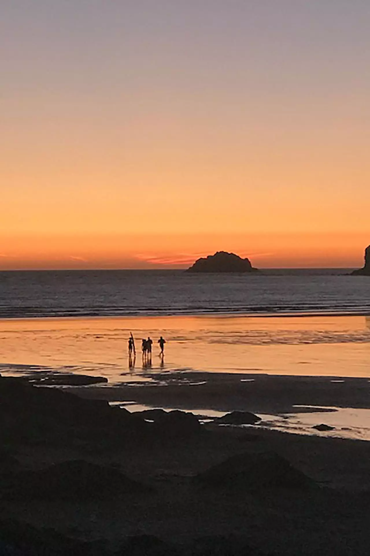 Solnedgång över Polzeath-stranden